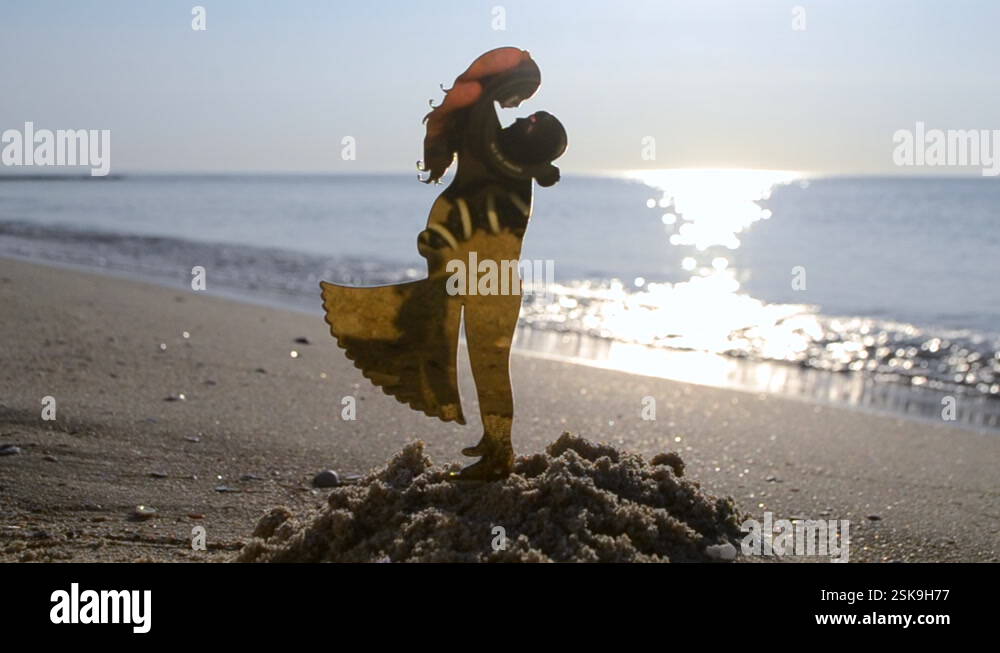 Plastic figure stick young people love girl guy hugging sand beach of ...