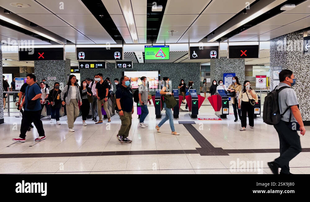 Rush Hour Crowd Exiting Payment Gates in an MTR Station in Hong Kong ...