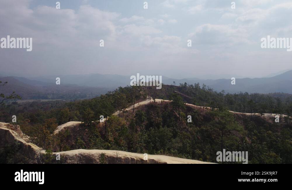 Sharp mountain ridge contrasting in colour with stiff mountain sides ...