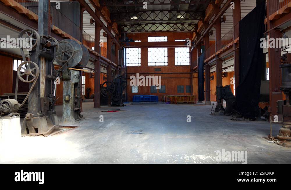 Abandoned industrial old forge with machinery and coal bunkers used ...