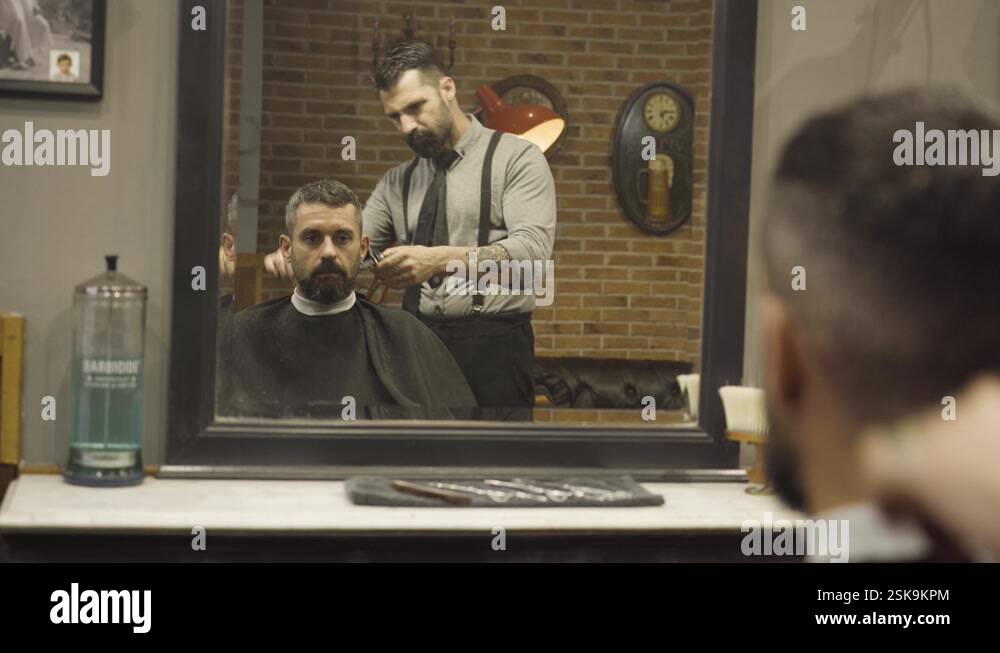 Barber Cutting Hair Of A Man With Trimmer In Barbershop - close up Stock Video Footage - Alamy