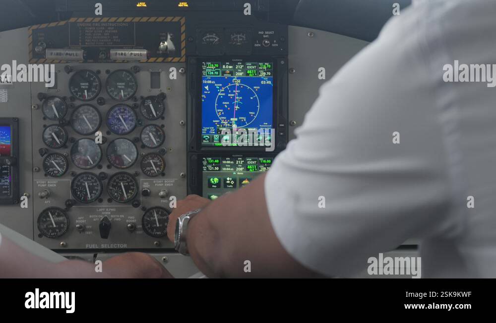 Pilots touching digital interface screen in cockpit dashboard of ...