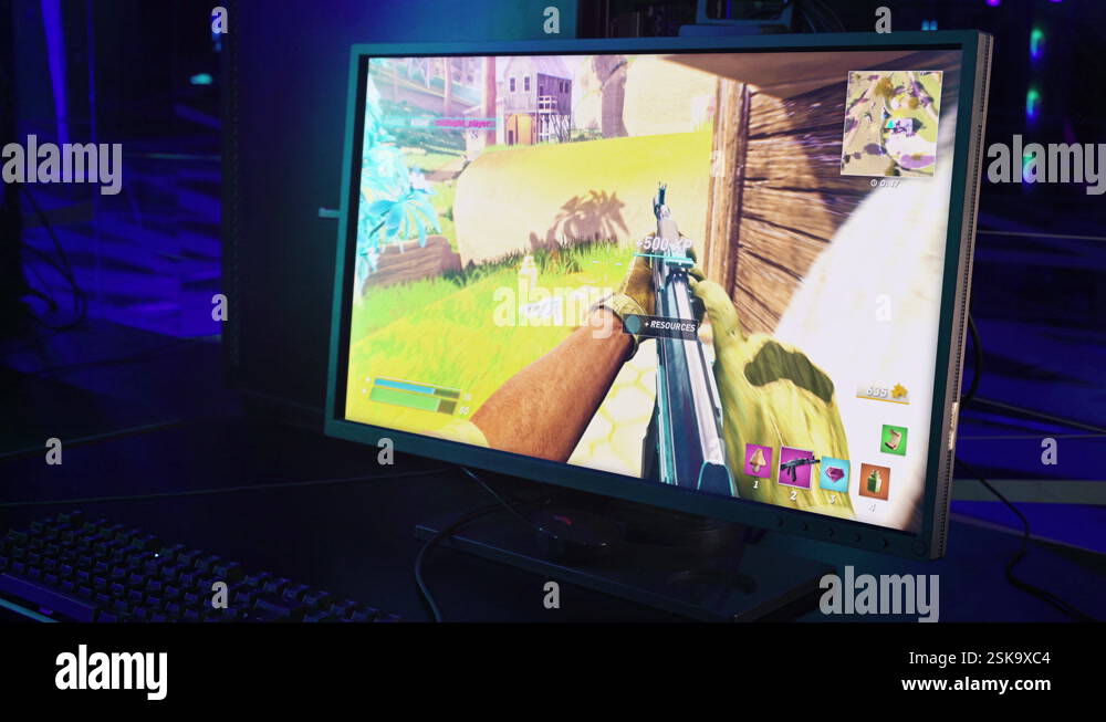 PC Monitor Shows Player Shooting Enemies In Fake Game With Cartoon ...