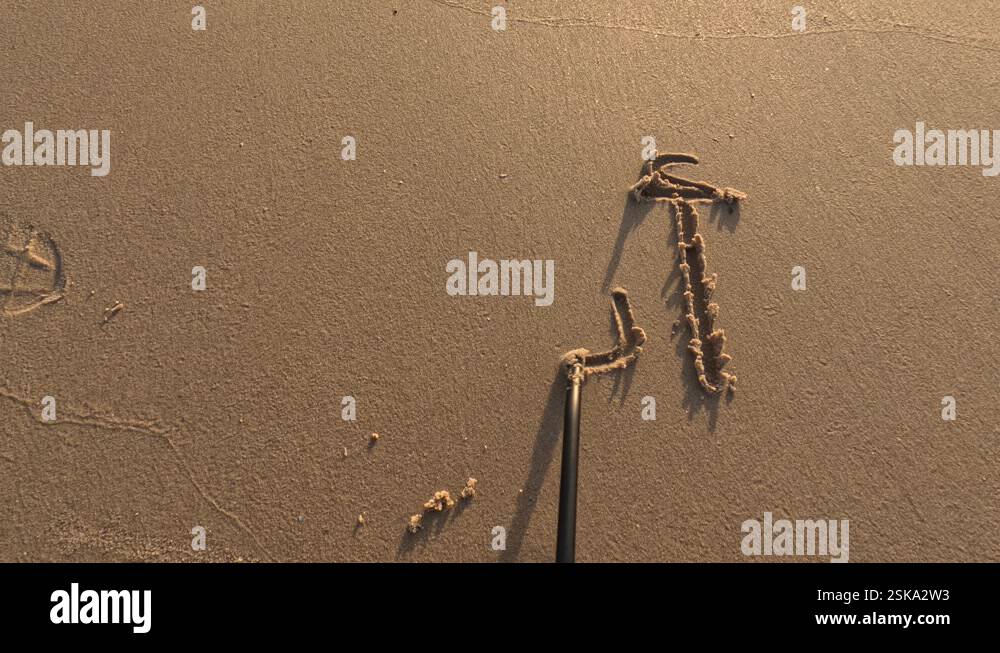 “Alif Baa” written by hand on beach sand,enjoying outdoor summer Stock ...