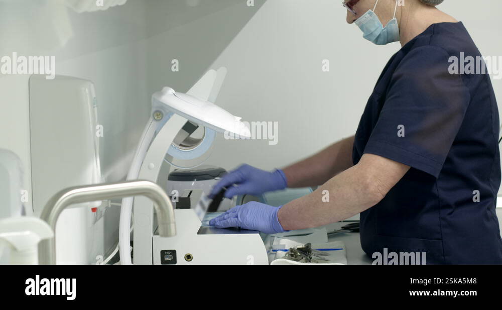 The doctor prepares sterile packages for a medical instrument Stock ...