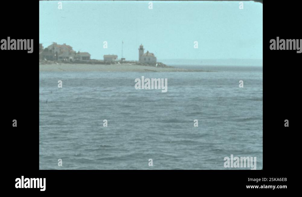 1960s: Lighthouse flashes signal to boat off shore Stock Video Footage ...