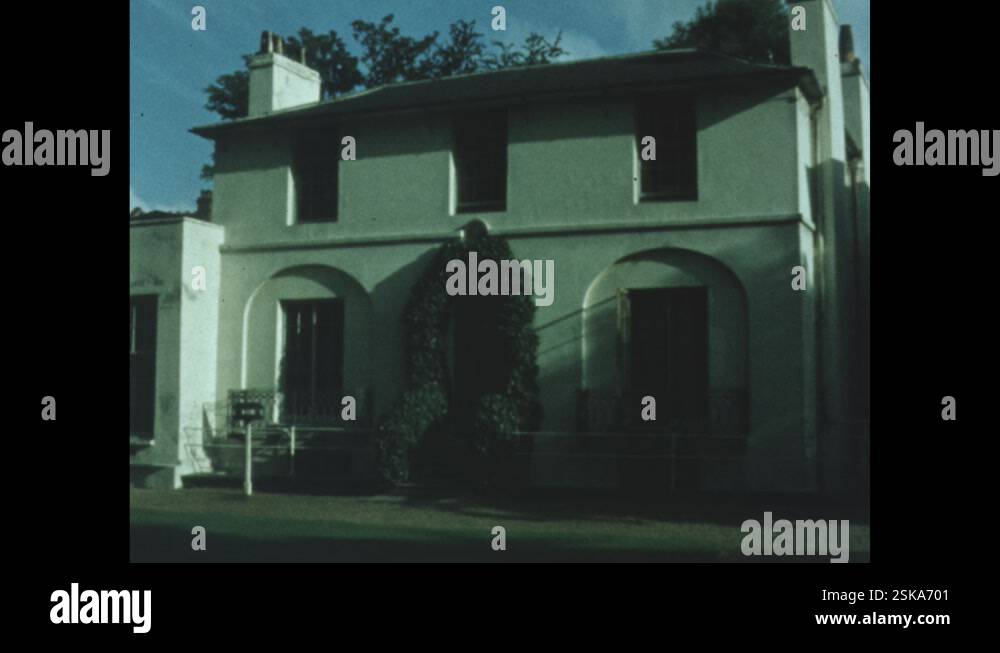1960s: Shadows fall over ivy-crowned door of manor house Stock Video ...