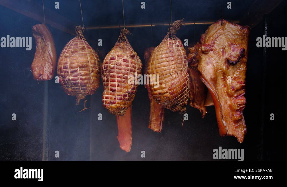 Half done smoked pieces or pork like ribs and pork belly and hams Stock ...