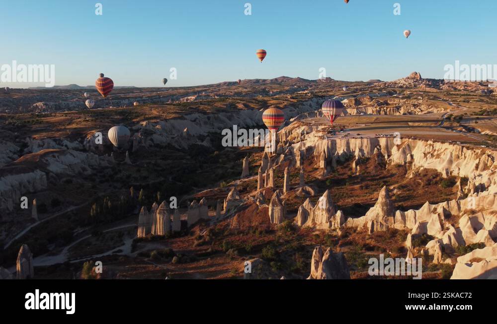 Sunrise shot of fairy chimneys rock formation in Love valley in ...