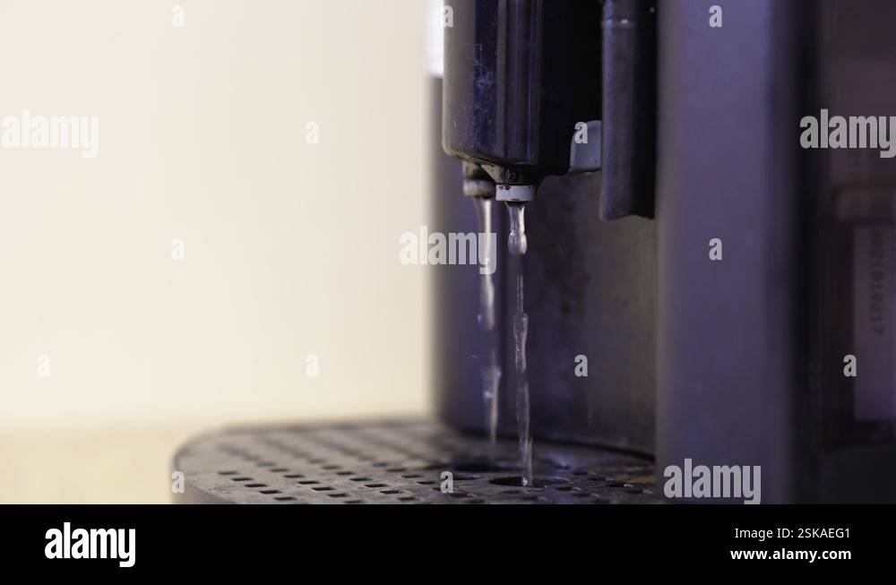 Rinsing the coffee machine after switching on Stock Video Footage - Alamy