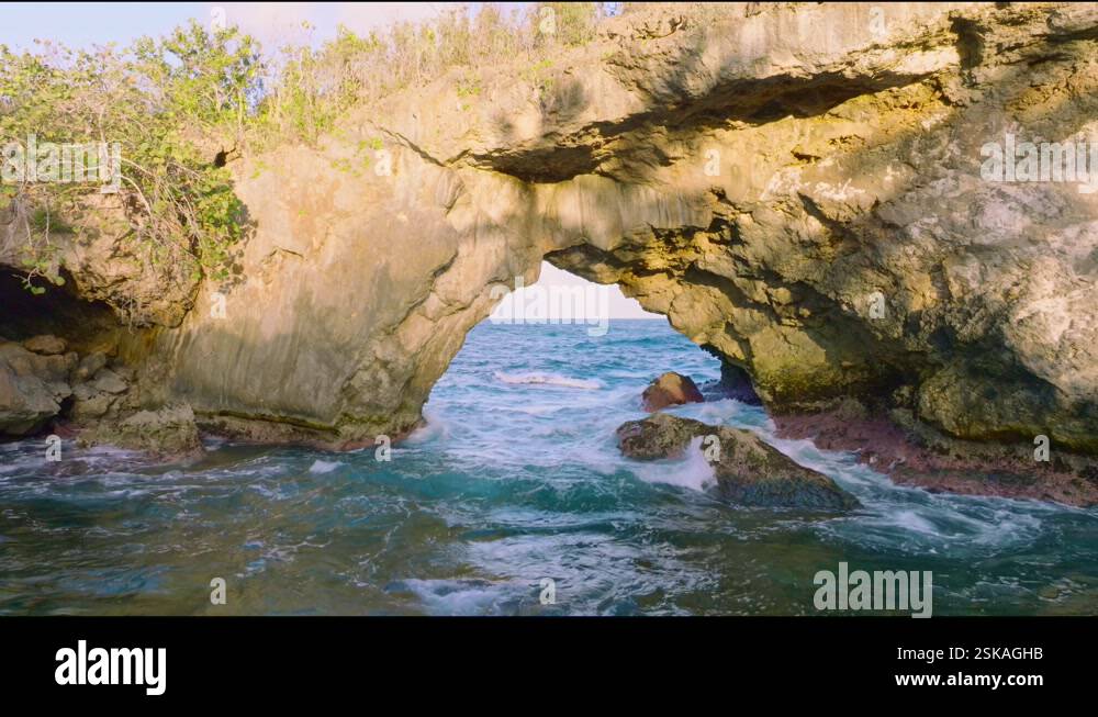 Natural stone arch, bridge in the ocean in Hondonada, Dominican ...