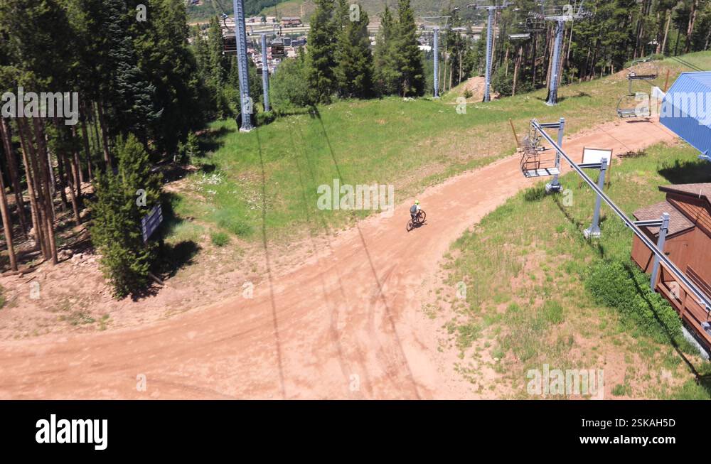Bike Riding on Vail Mountain, Gondola Perspective of a Bike Rider on Ski Stock Video Footage - Alamy