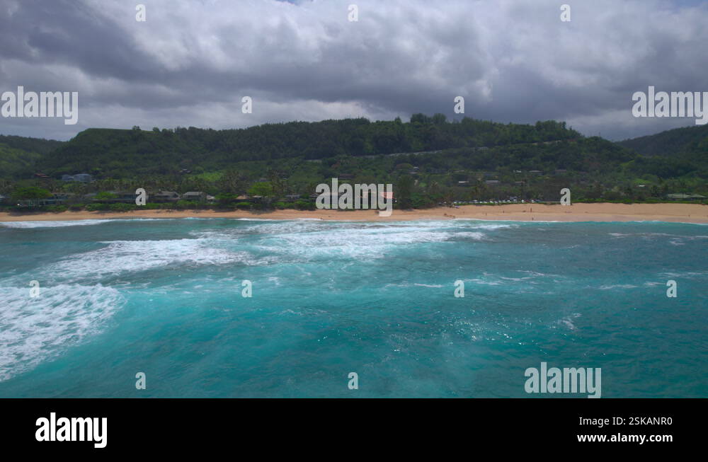 Water to shore aerial view of Oahu Hawaii North Shore beach. 4k drone ...