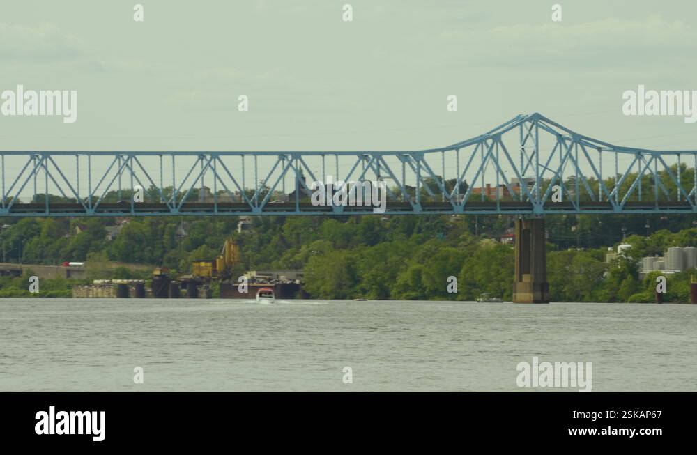 panning to the left on a long blue truss bridge in Pennsylvania, Monaca ...