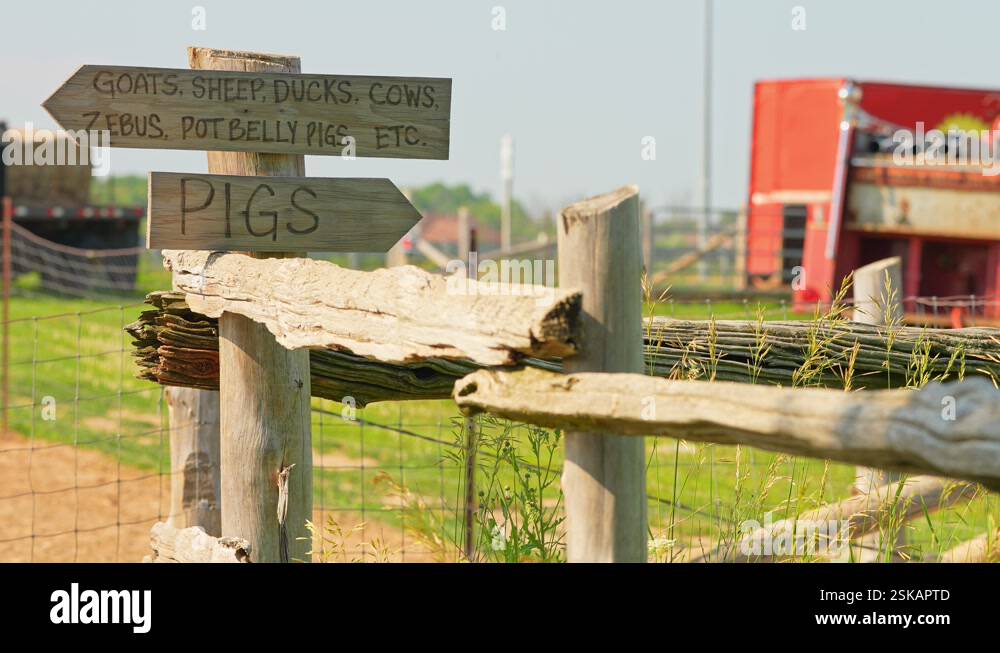 Sign directions at the gate of animal feeding farm, Goats, Sheep, Ducks ...