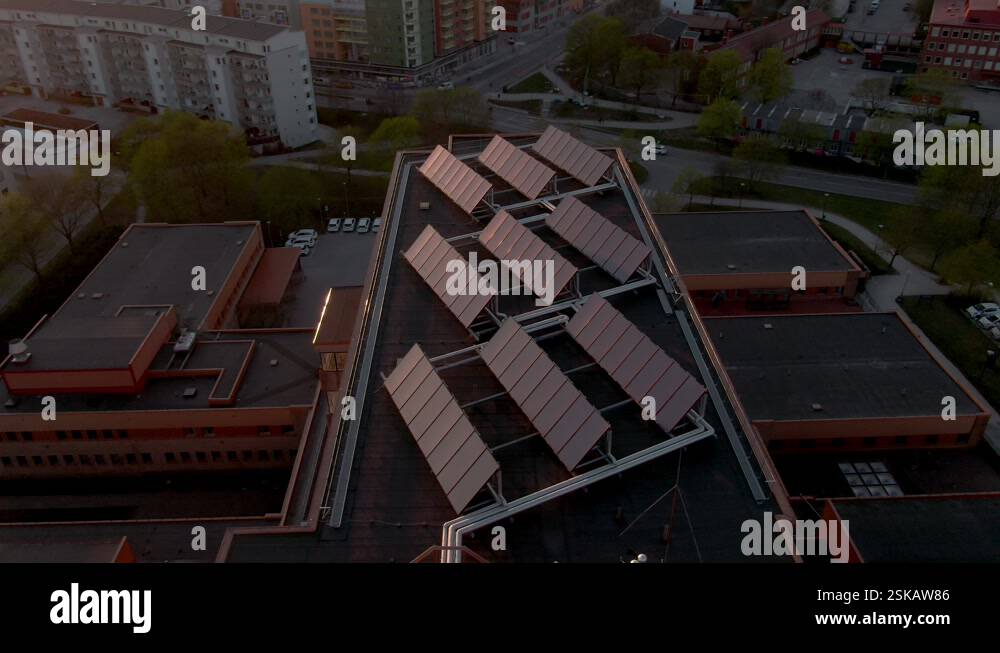 Solar panels atop building. Drone orbital view Stock Video Footage - Alamy