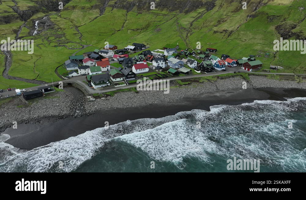 Tjørnuvík village, Faroe Islands: aerial view traveling out to the ...