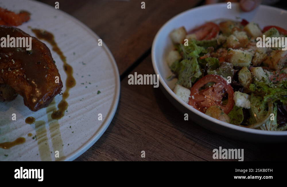 Serving Italian food dishes hand arrange on table penne chilli salad ...