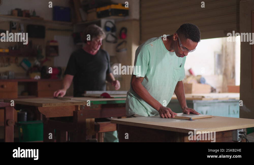 Candid Carpentry Workshop Scene of Master Carpenter and Apprentice at ...