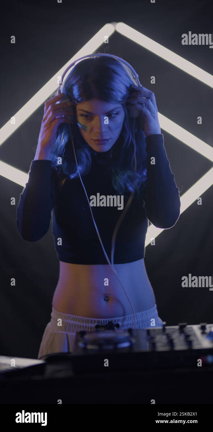 Female DJ playing on a mixer. Girl mixing trance music. Futuristic ...