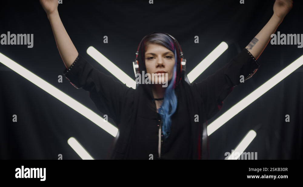 Female DJ playing on a mixer. Girl mixing trance music. Futuristic ...