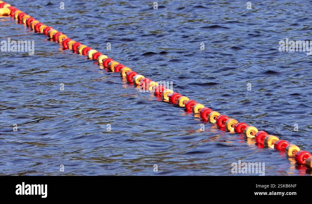 floating barrier red yellow swimming area Stock Video Footage - Alamy