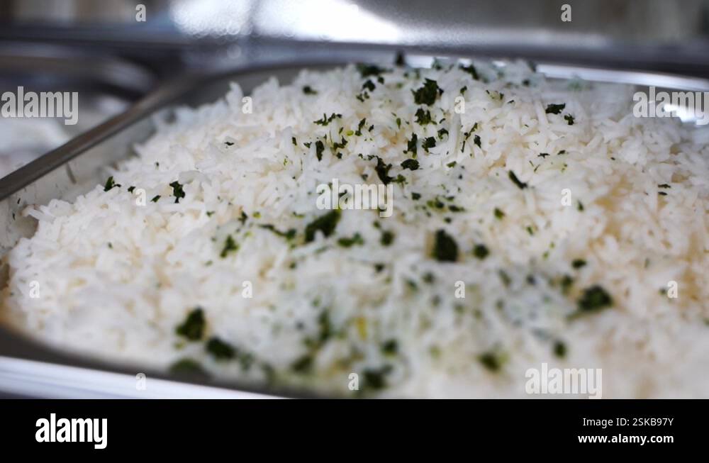 Rice in a large metal bowl in a buffet at a private event in a hotel in ...