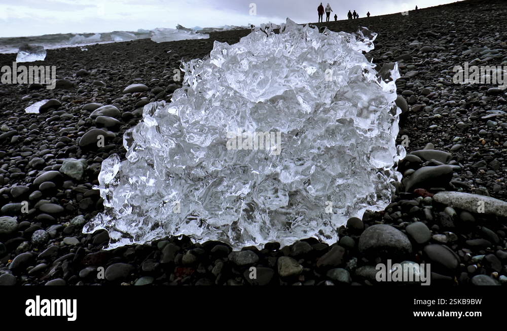 Lump of ice on Diamond Beach from Jokulsarlon Glacier Lagoon in Iceland ...