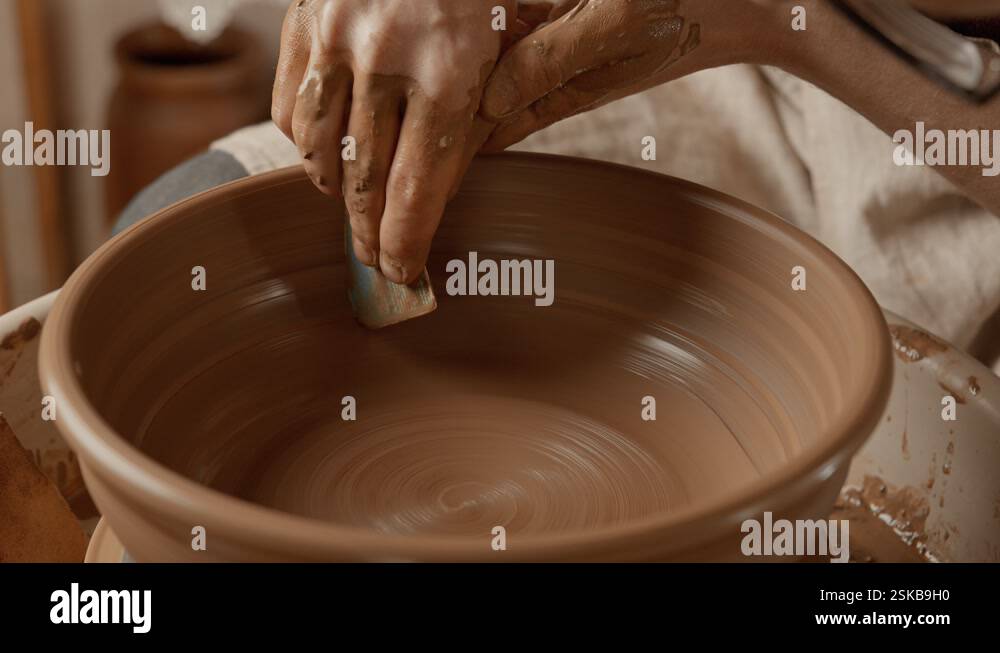 Ceramist work with clay. Working process in ceramic workshop. Potter ...