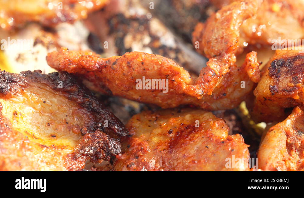 Close-up chicken meat with skin Roasted on grill rack, cooking outdoors ...
