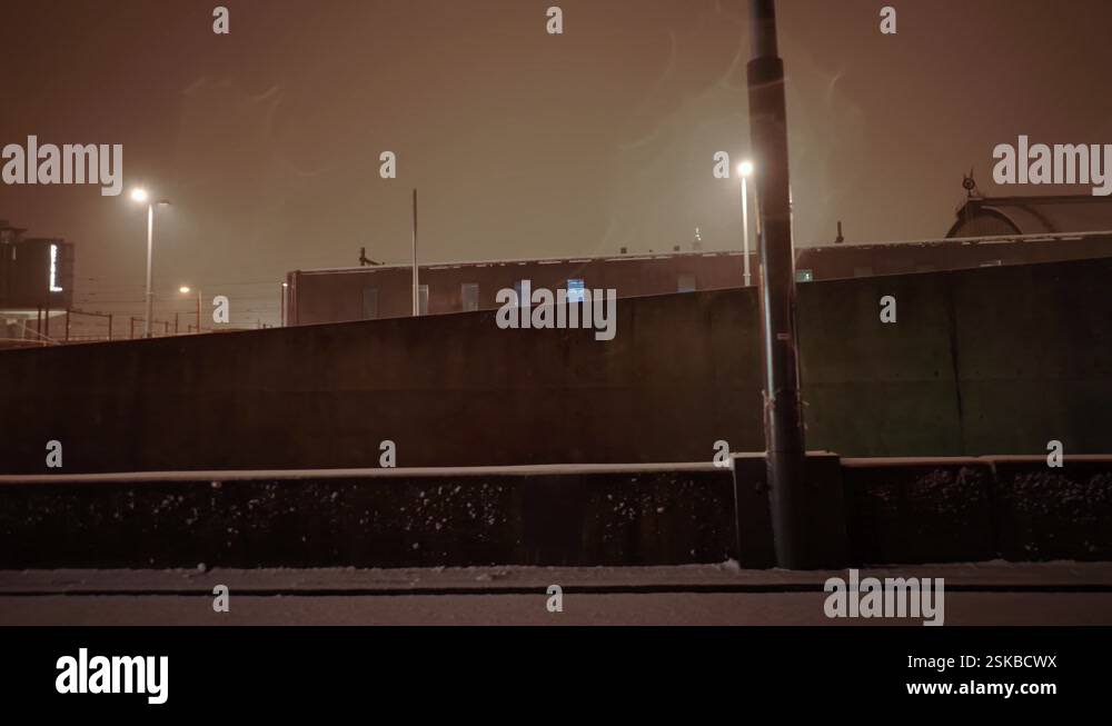 Poorly lit creepy backside of Amsterdam Central Station at night Stock ...