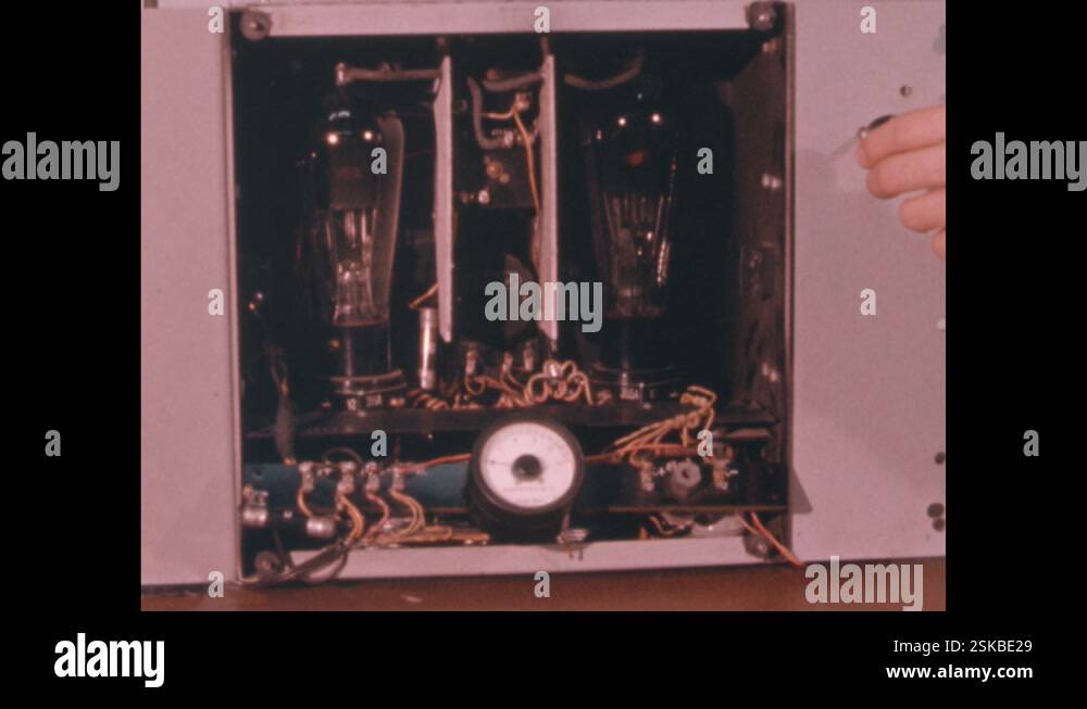 1960s: Two lightbulbs, tubes and wires with a meter attached, inside a ...