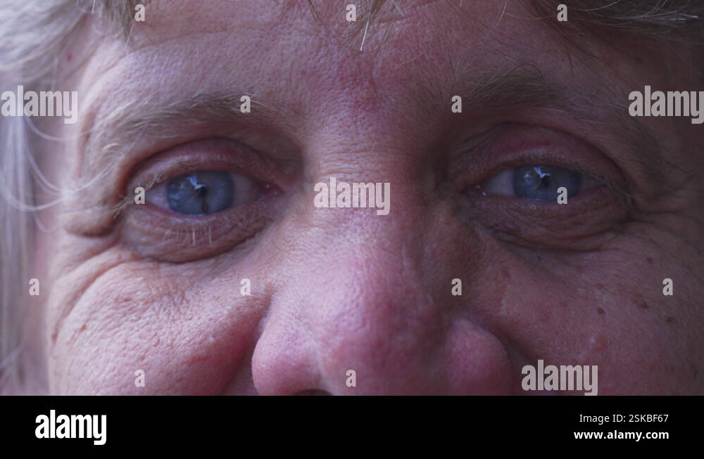 Smiling Senior Man's Blue Eyes Close-Up, Display of Age and Wisdom in ...
