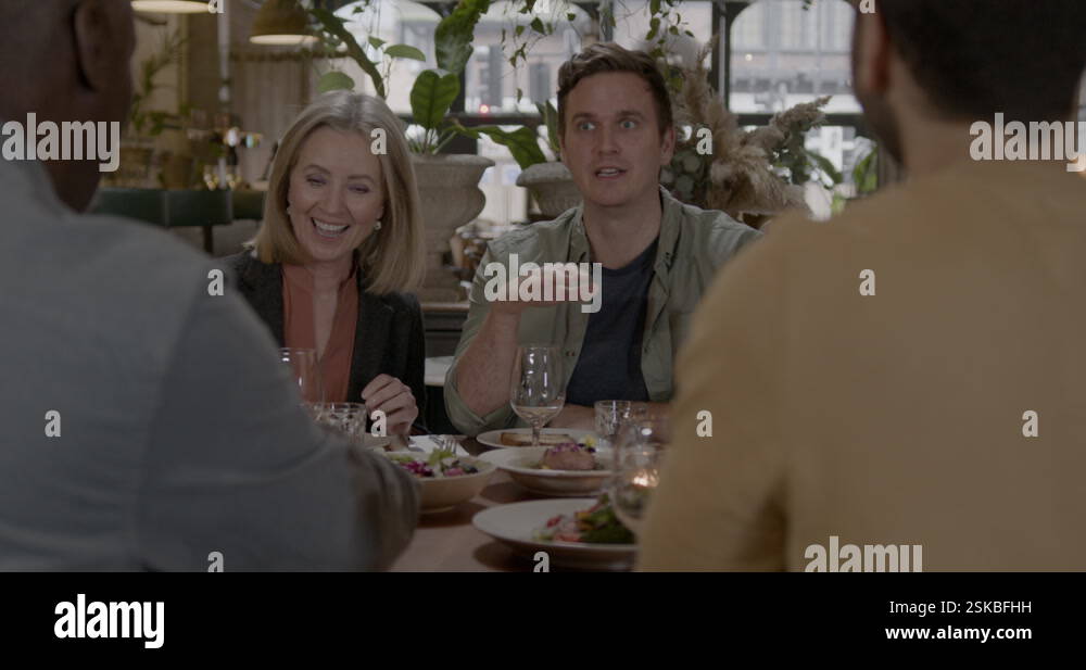 Family and Friends Enjoying Dinner in Restaurant Together Stock Video ...