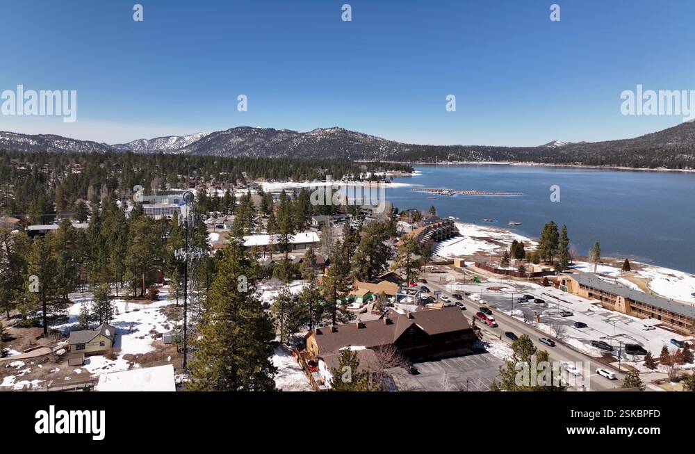 Big Bear Mountain Lake and town view with cars driving by on daytime ...