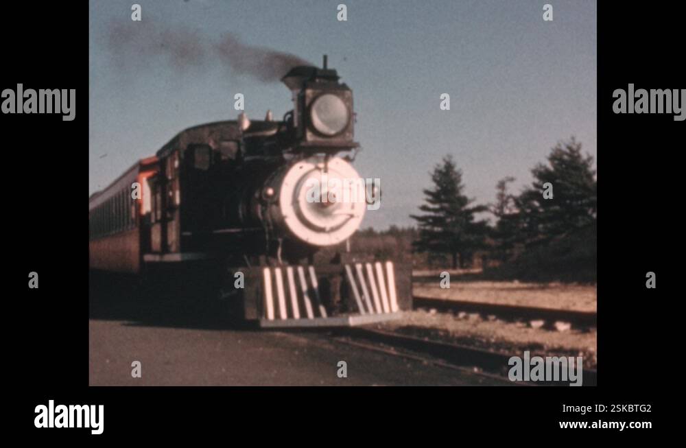 1960s: Old Colony railroad steam passenger train stops at station ...