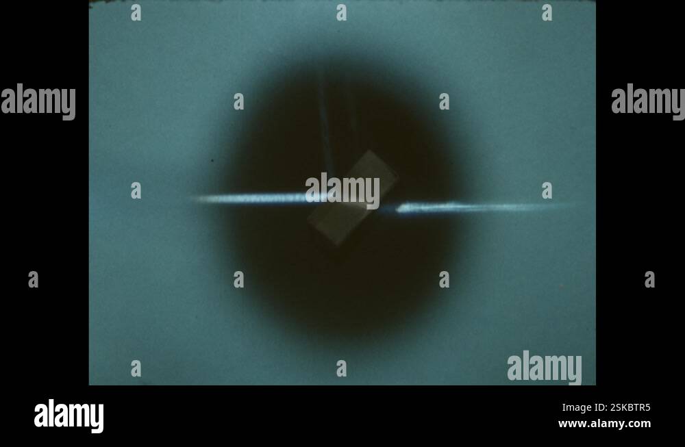 1960s: Beam of light passing through and reflect off a prism Stock ...