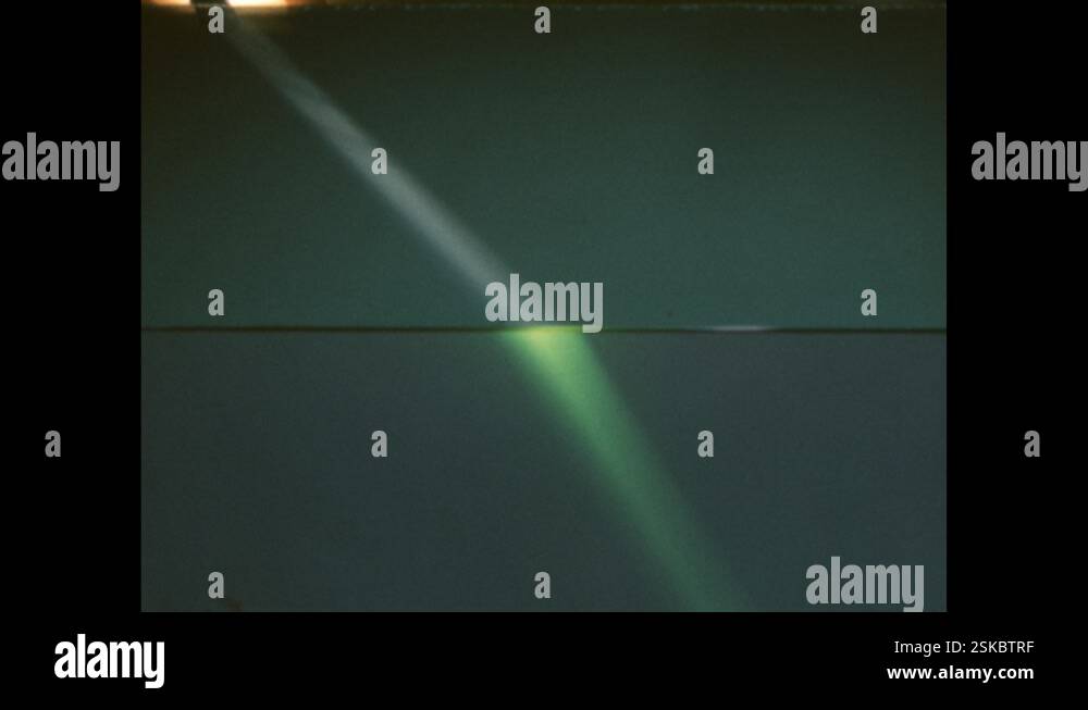1960s: Beam of light being refracted by the surface of the water Stock ...