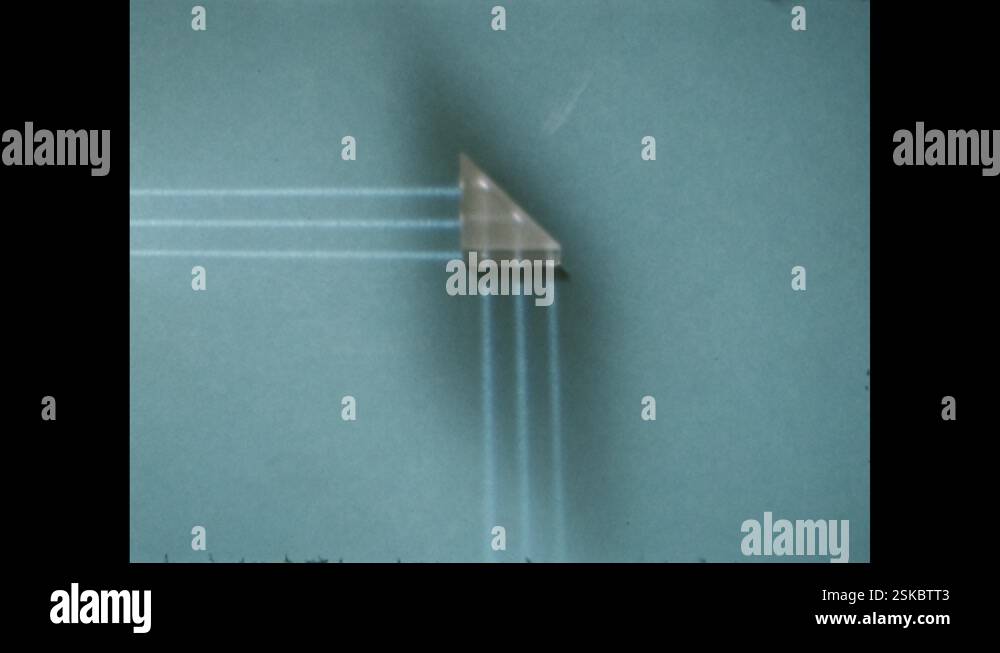 1960s: Three beams of light reflecting through a prism Stock Video ...