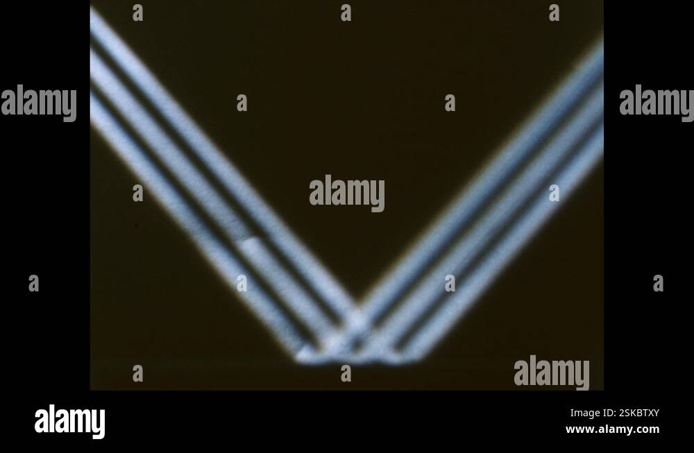 1960s: Three beams of light reflecting at an angle Stock Video Footage ...