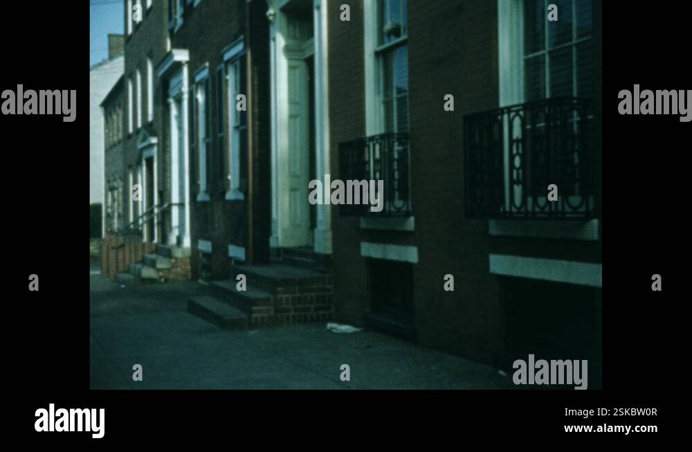 1960s: row houses on a street with doorways, stone steps and low ...