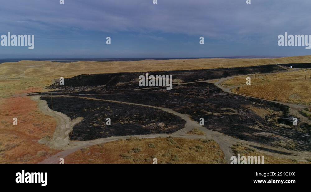 4k drone flyover with pan down of fresh burn scars showing the planes ...