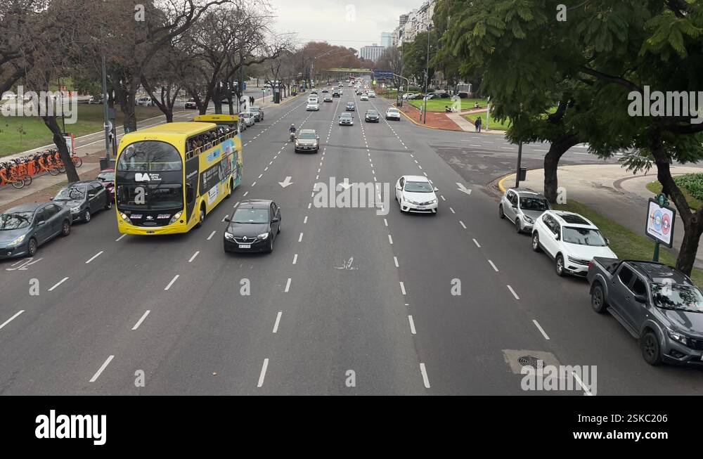 Multi-lane road in Buenos Aires, vehicles drive towards the camera ...