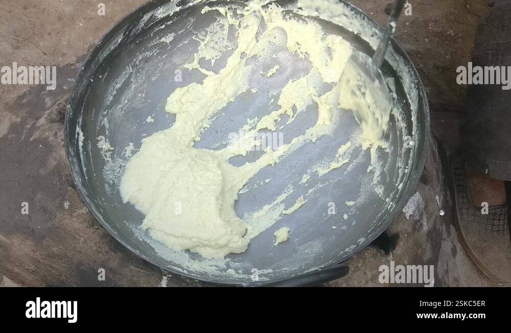 Scene from above showing the process of making sweet batter from heated ...