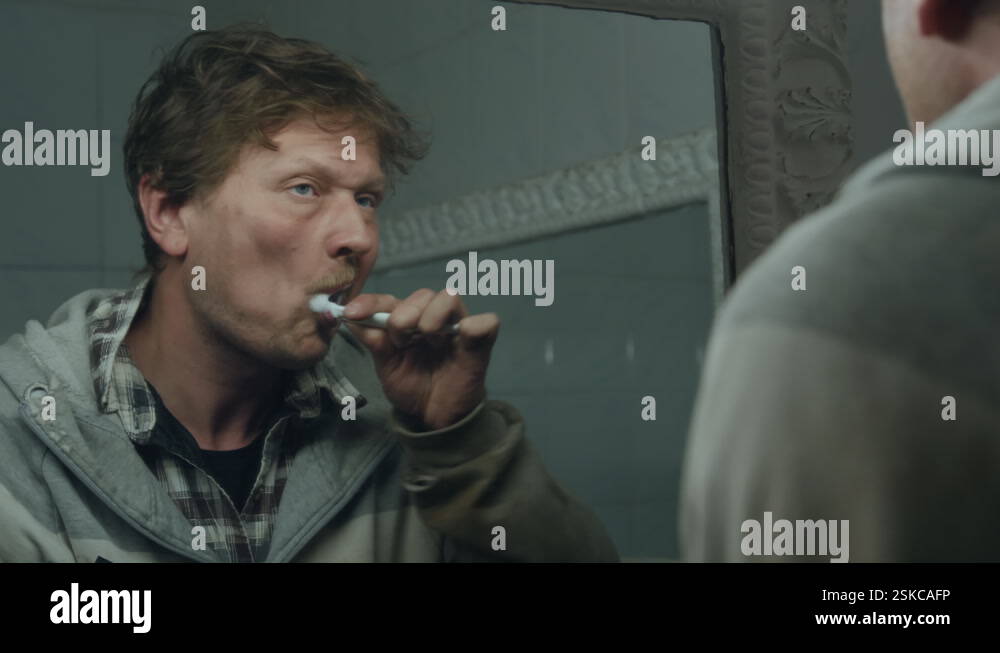 Homeless Cleaning His Teeth in front of Mirror Stock Video Footage - Alamy