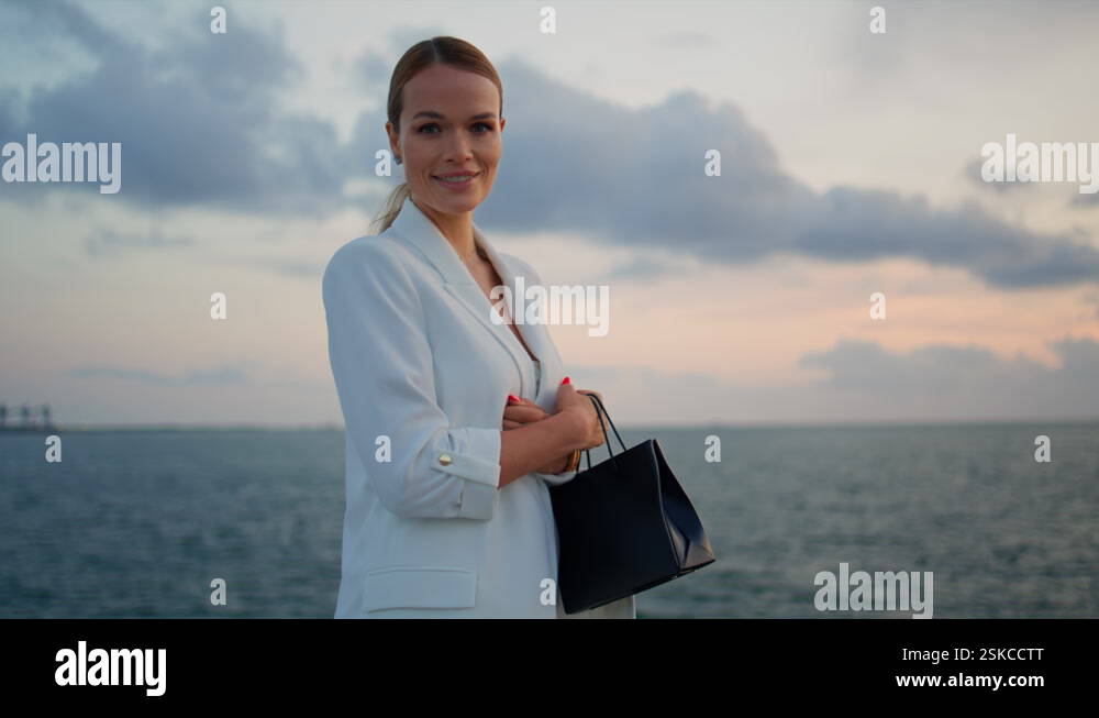 Lady boss standing sunset sky looking camera close up. Woman posing at ...