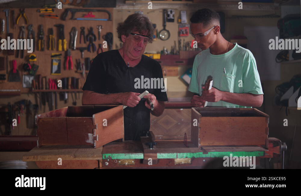Carpentry Workshop of Master Carpenter and Apprentice Measuring Wood ...