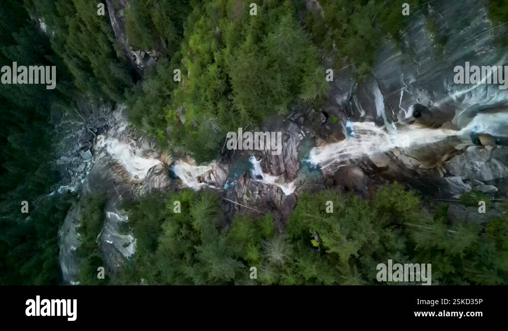 Aerial topdown ascent of Shannon Falls waterfall, dusk, Squamish, BC ...