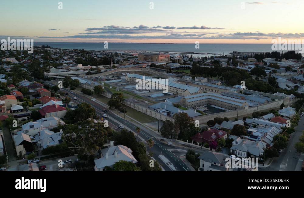 Aerial flyover city with traffic on road and Fremantle Prison YHA in ...