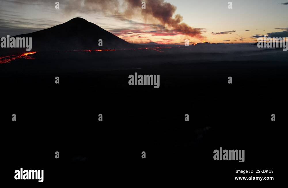 Impressive lava flow and moss fire sparks while the cone is putting up ...